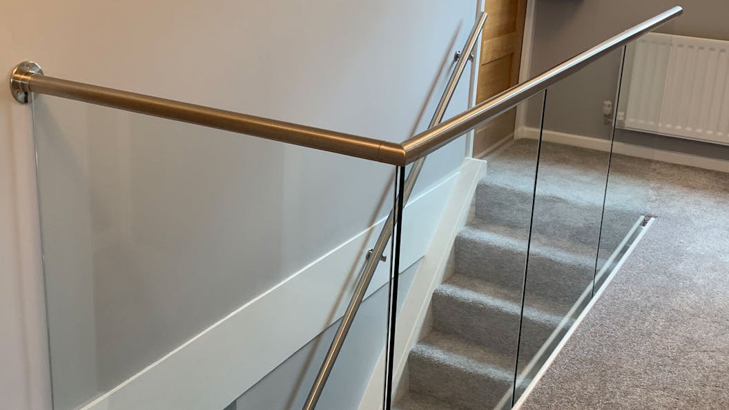 Stainless & glass balustrade install to stairs and landing